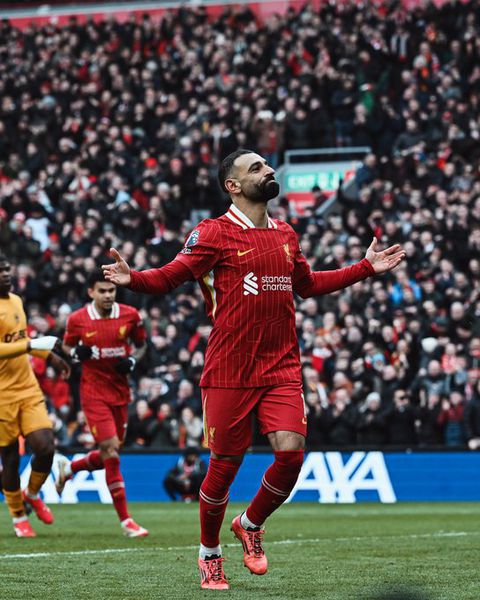 Salah on target as Liverpool survive Wolves scare to continue march ...
