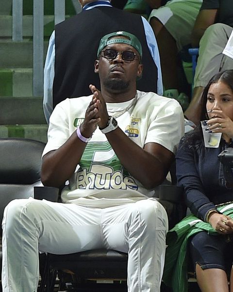 Usain Bolt and partner Kasi Bennett pull up for Dallas Wings vs Aces ...