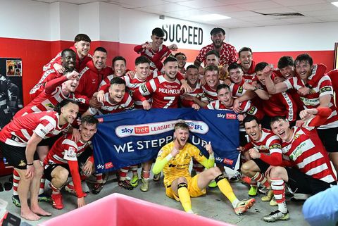 Joseph Olowu celebrates Doncaster Rovers promotion with Nigerian flag ...